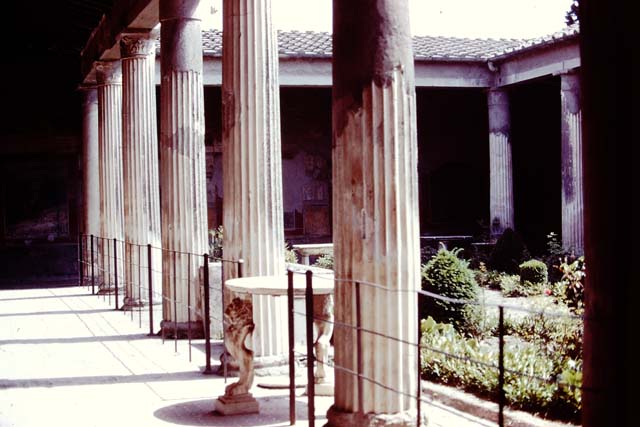 VI.15.1 Pompeii. December 2006. Table with three lion legs in peristyle.