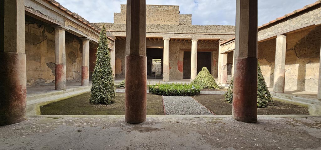 V.2.i Pompeii. December 2023. Room 23, looking north from south portico ...