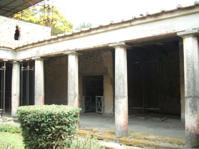 V.2.i Pompeii. December 2007. Room 23, painted masks on south side of ...